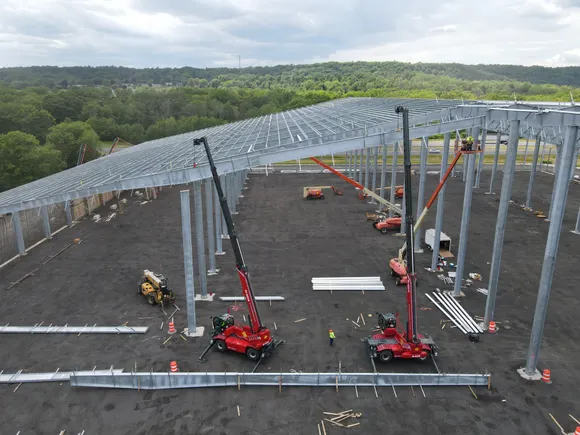 Why rotating telehandlers are changing construction | Construction Dive