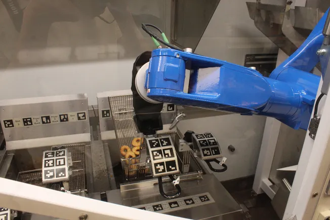 Inside the restaurant: How a fry cook robot holds the line for White ...