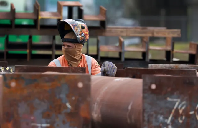 A fifth of construction workers lack permanent legal status. Can the ...