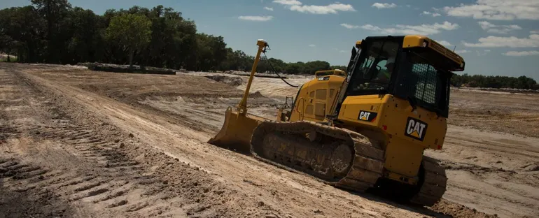 Caterpillar plans to scale up autonomous truck fleet | Construction Dive